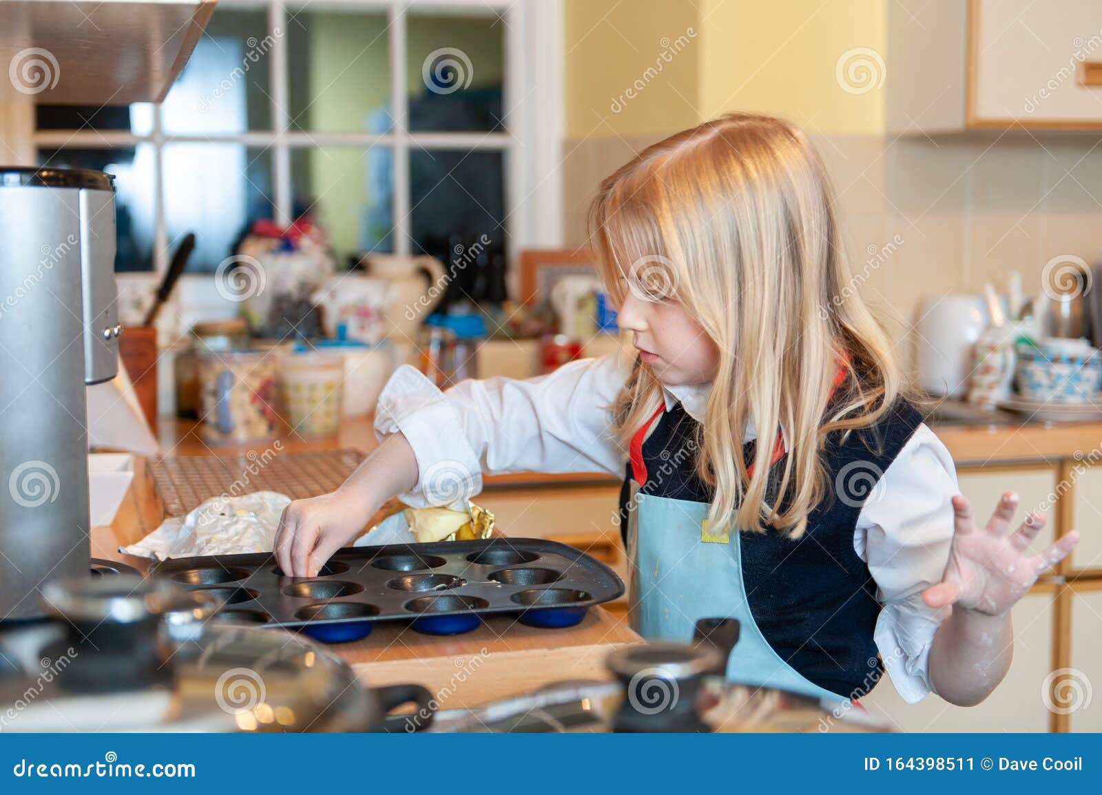 Pretty Young Blonde Girl Baking in a Messy Kitchen Stock Image - Image ...