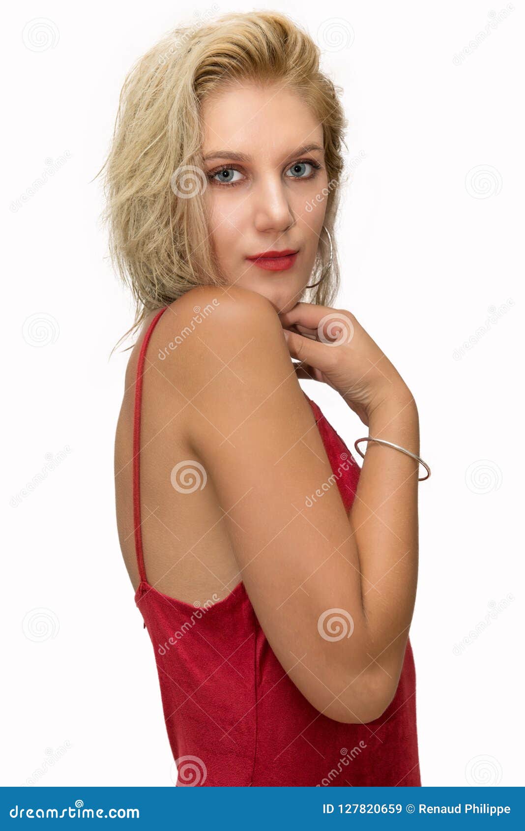 Pretty Young Blonde Woman With A Red Dress On White Background Stock