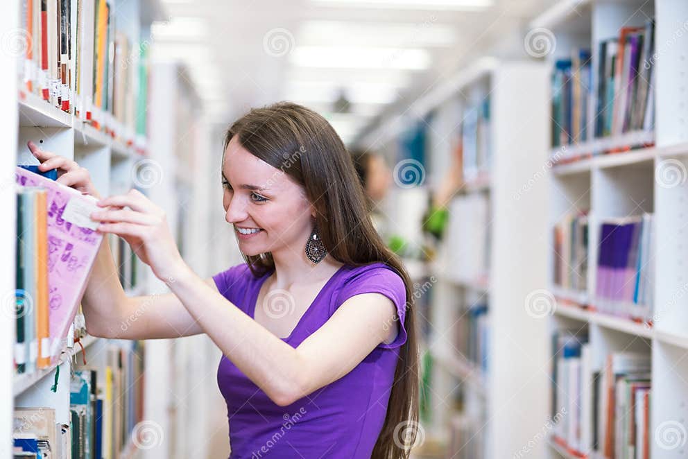 Pretty, Young College Student in a Library Stock Image - Image of ...