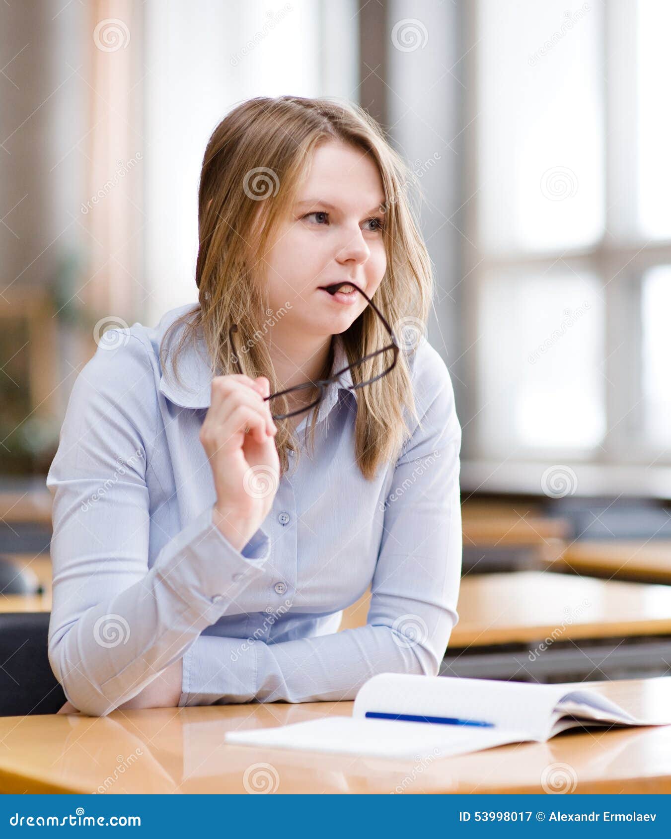 Pretty Young College Student in a Library Looking Away Stock Image ...