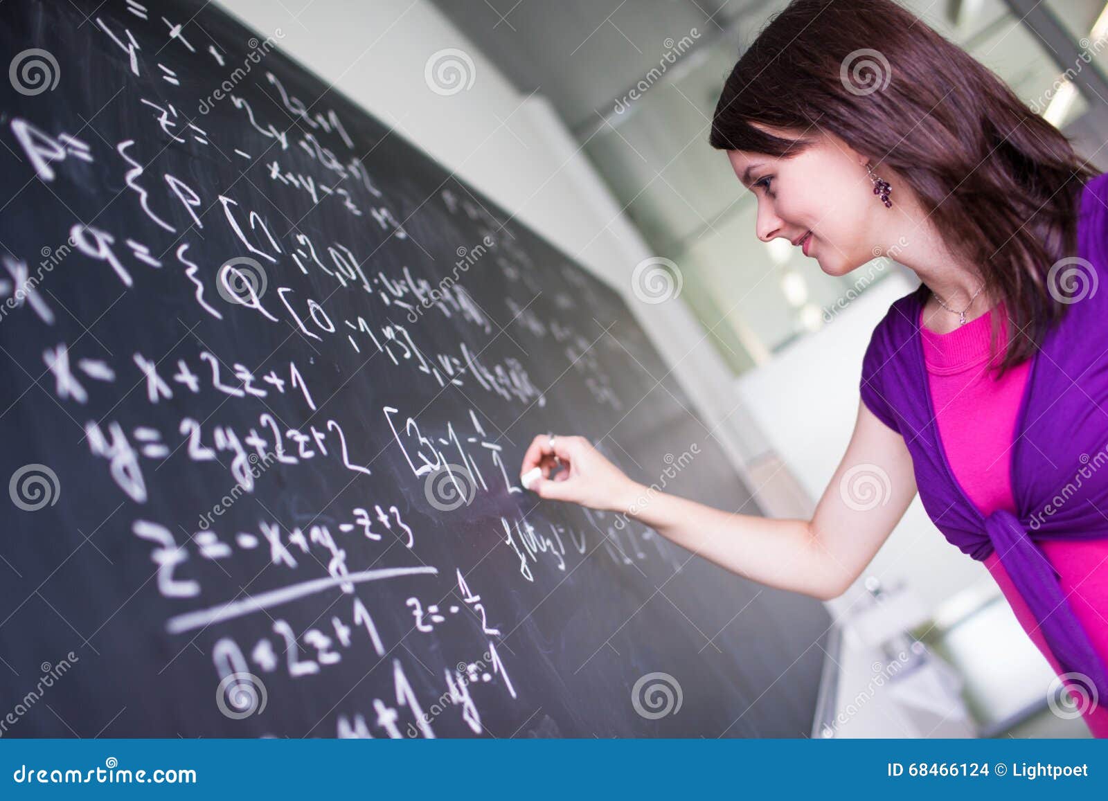 Pretty, Young College Student Writing on the Chalkboard/blackboard ...