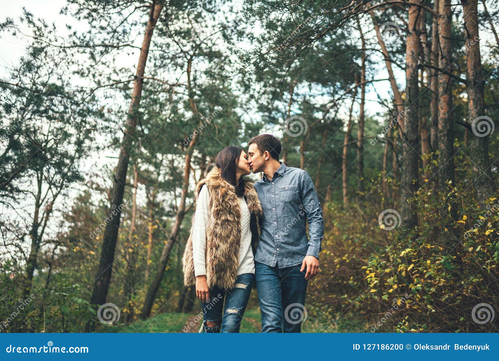 Pretty Young Couple Walking Together in the Forest. Stock Photo - Image ...