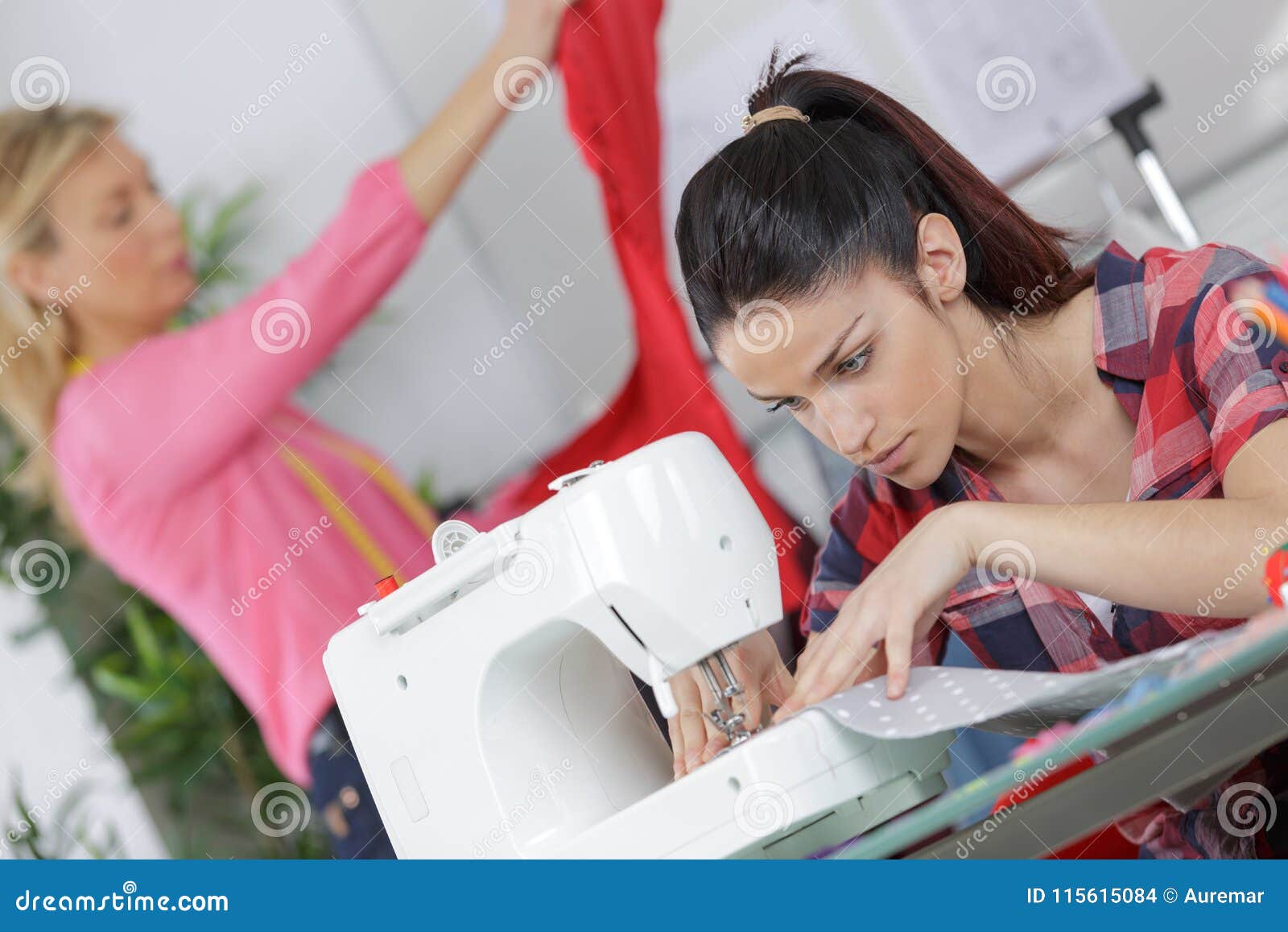 Pretty Young Dressmaker with Sewing Machine Stock Photo - Image of ...