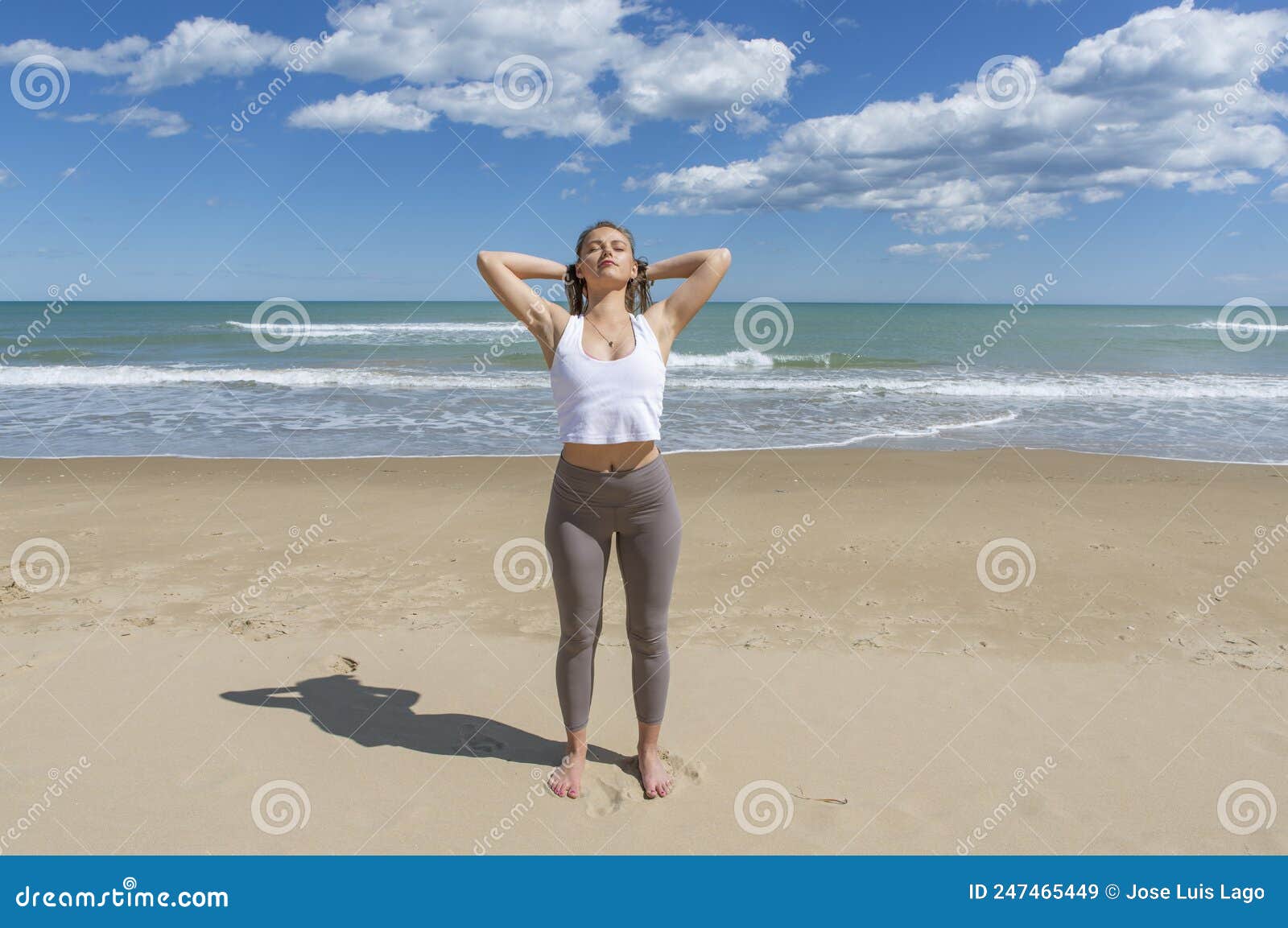 Pretty Young Female Athlete Stretching on the Beach Shore Stock Image ...