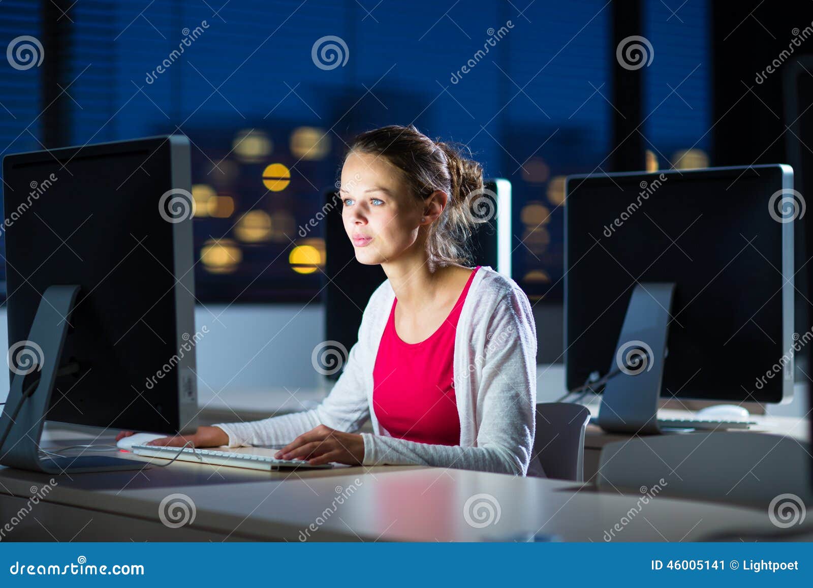 Pretty, Young Female College Student Using a Desktop Computer Stock ...