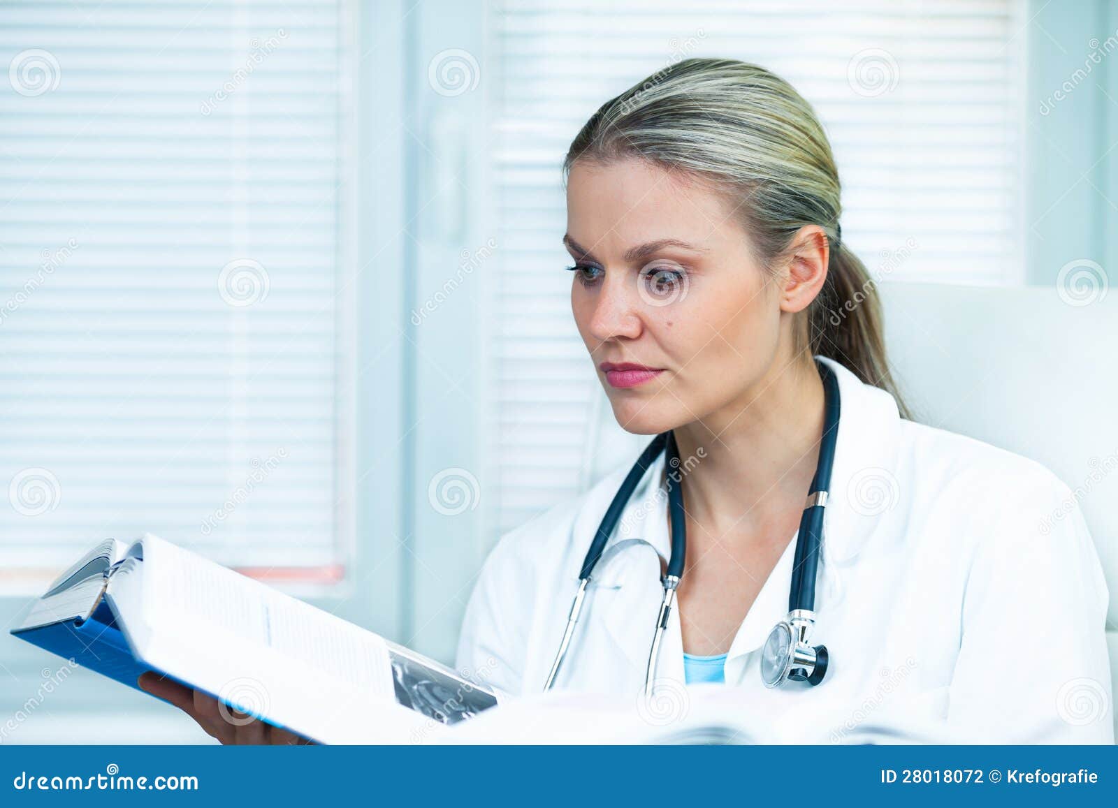 Pretty Young Female Doctor is Studying Stock Photo - Image of blue ...