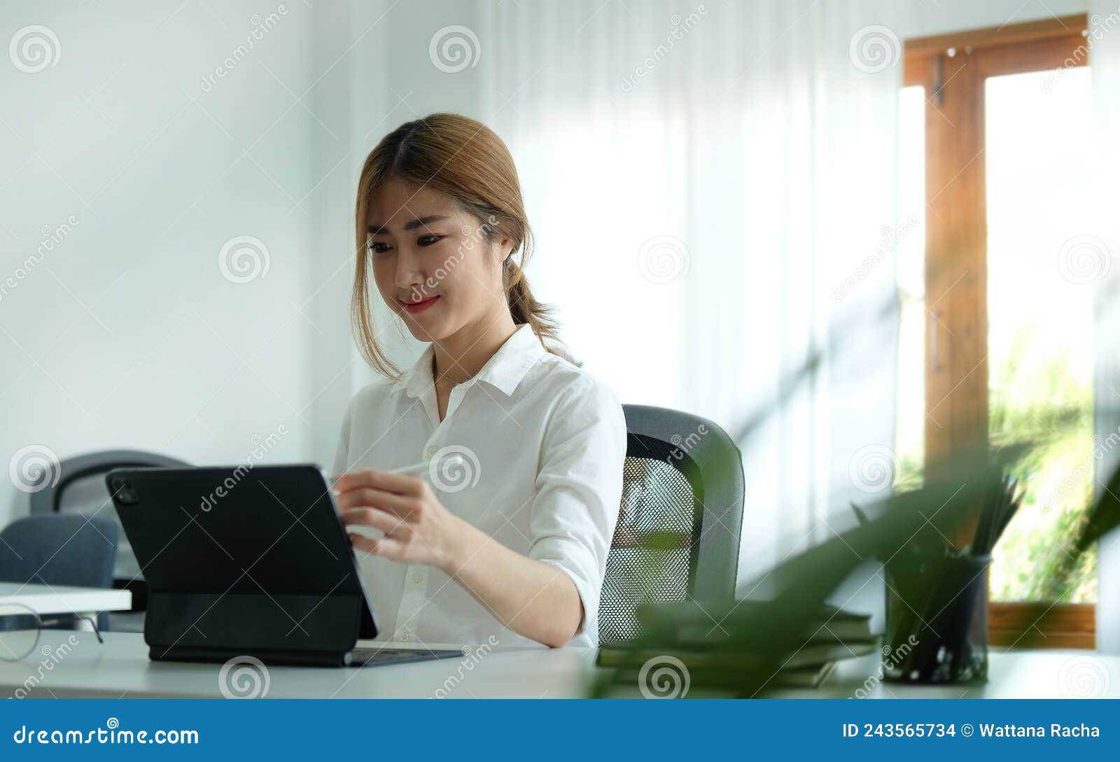 Pretty Young Female Office Worker Using Computer Tablet at Modern ...