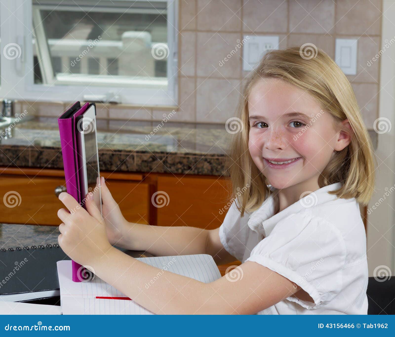 Pretty Young Girl Doing Her Homework in the Kitchen Stock Photo - Image ...