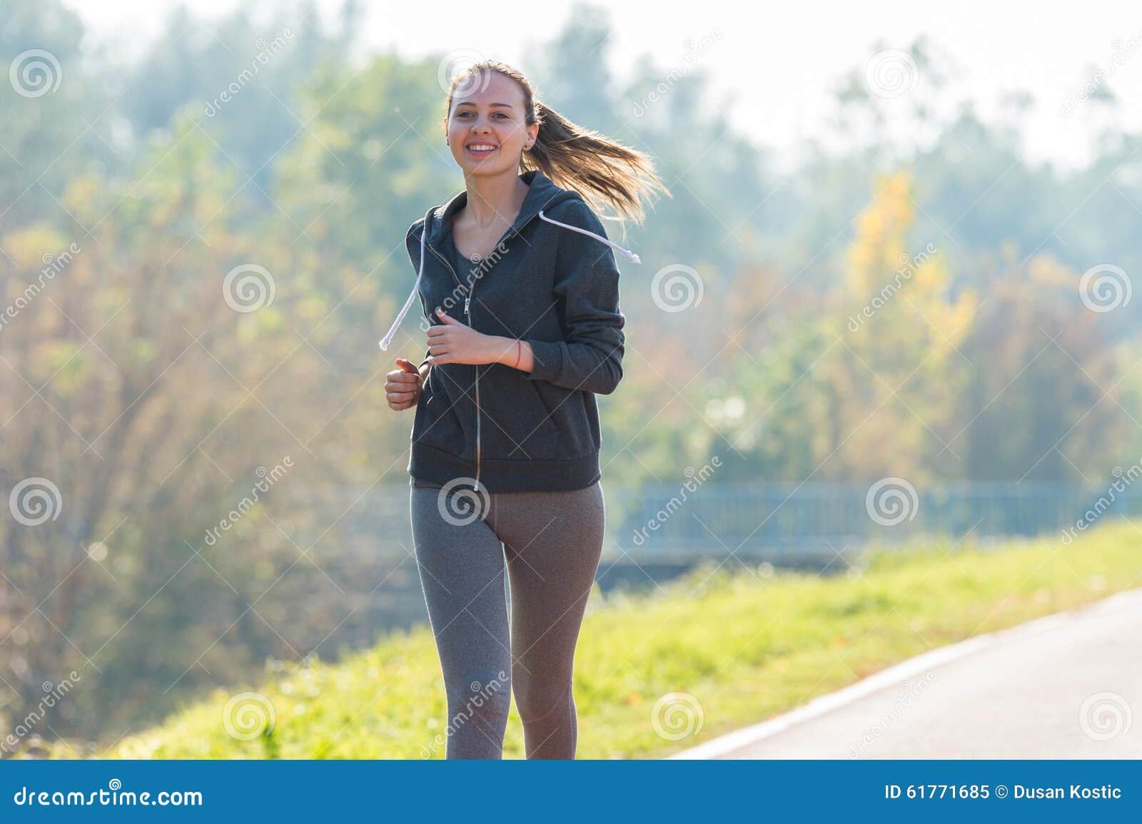 Pretty young girl jogging stock image. Image of forest - 61771685