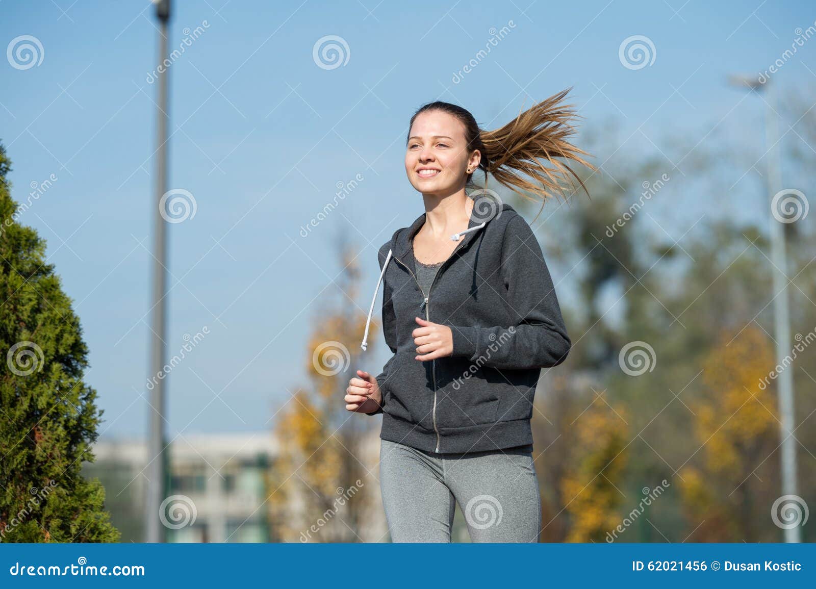 Pretty young girl jogging stock photo. Image of leaf - 62021456