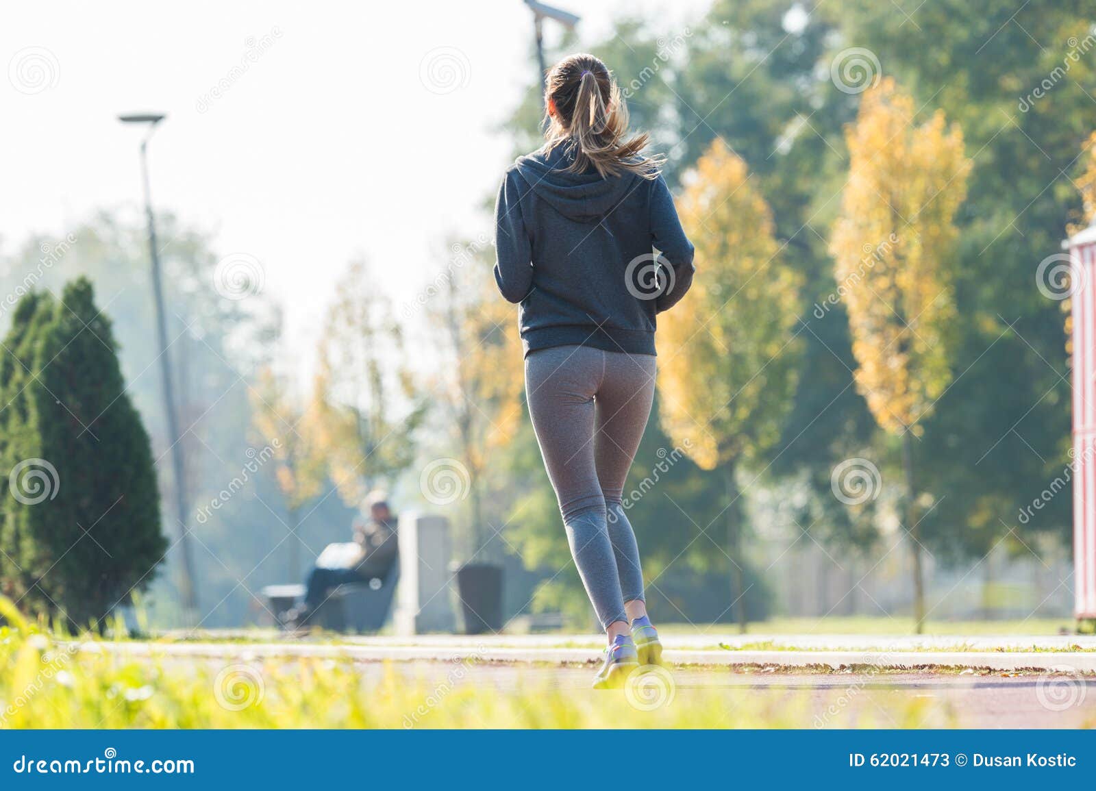Pretty young girl jogging stock image. Image of leaf - 62021473