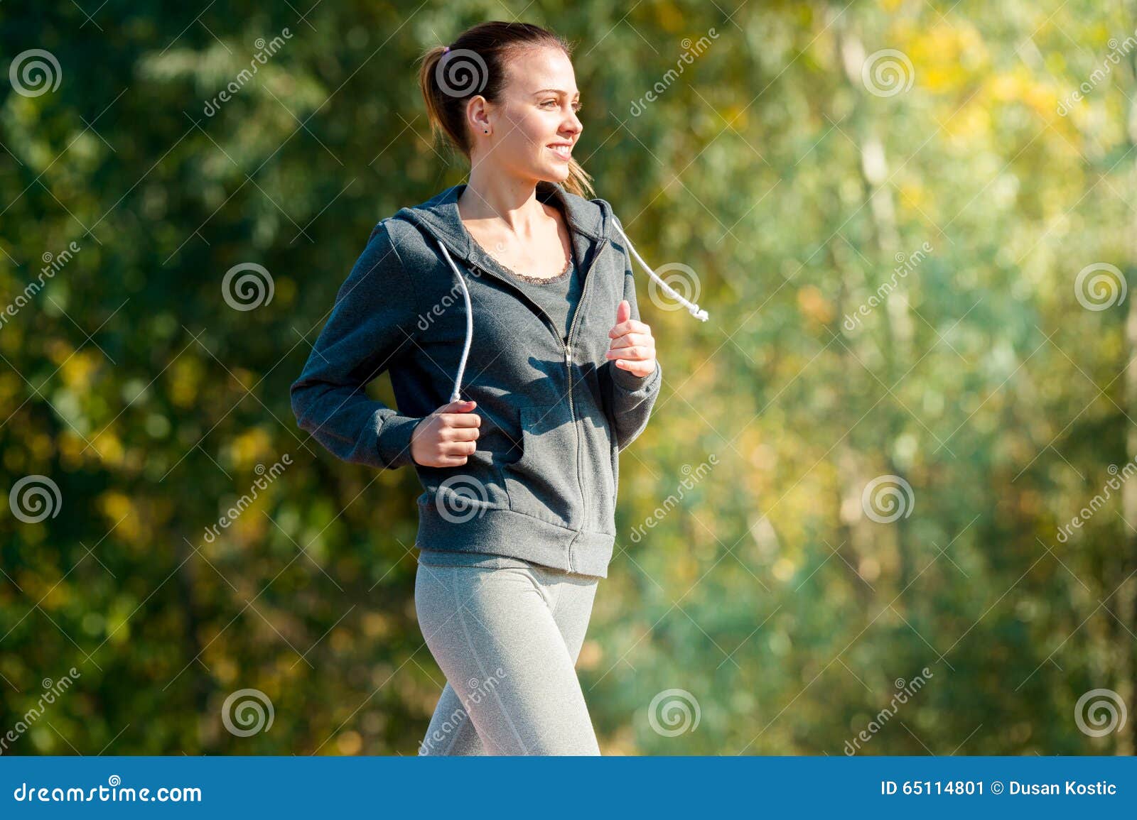 Pretty young girl jogging stock image. Image of exercise - 65114801