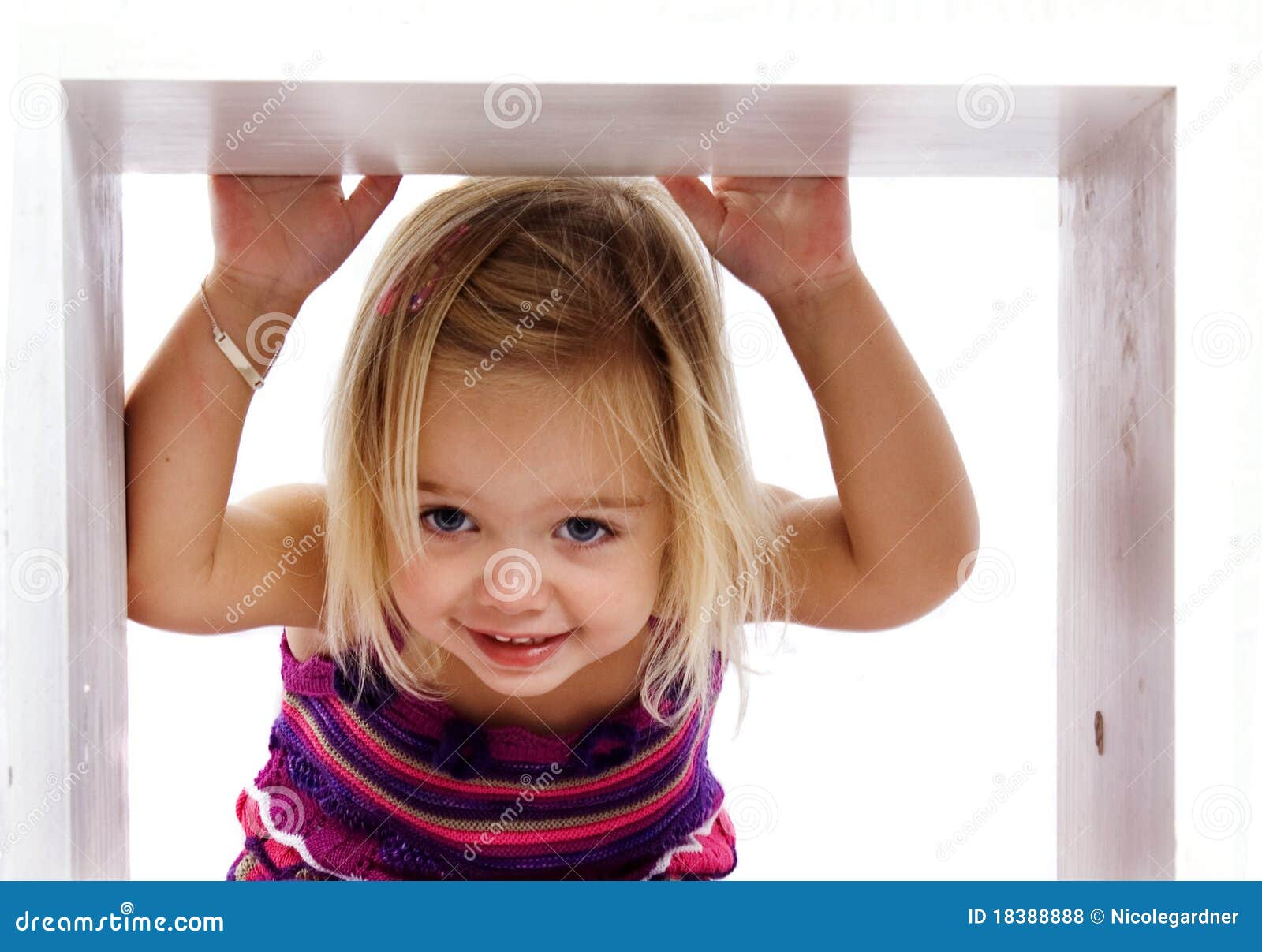 Pretty Young Girl Smiling through a Box Stock Photo - Image of child ...