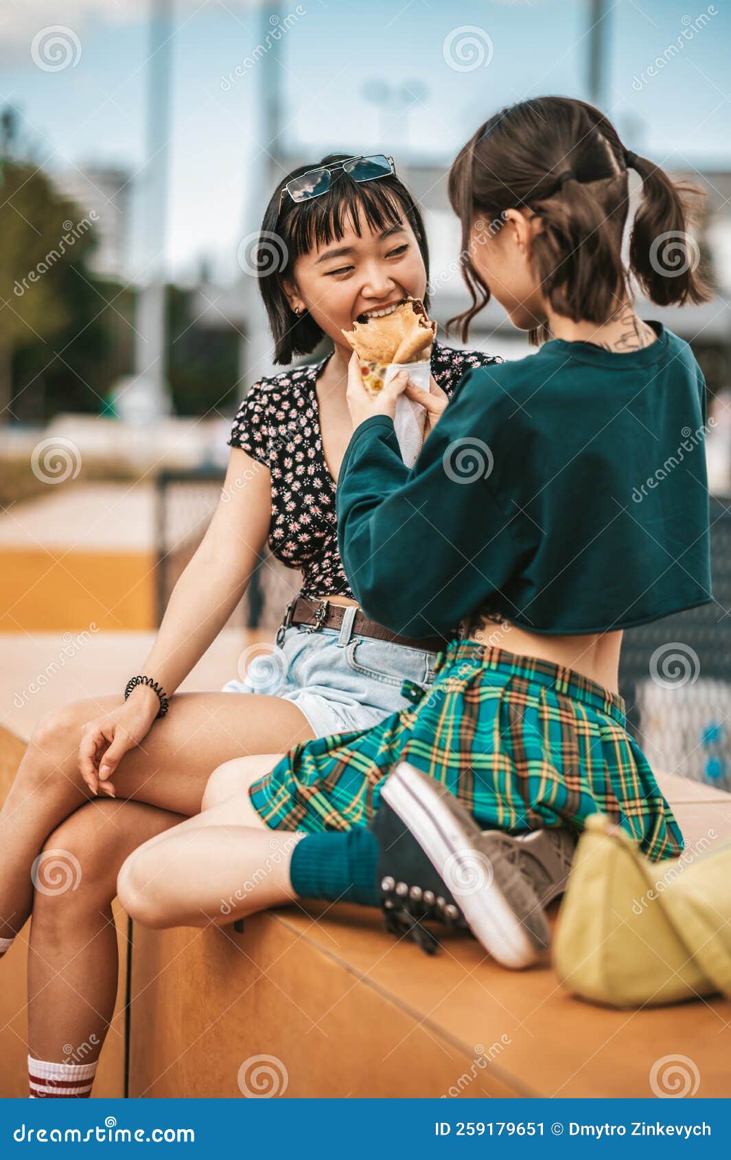 Pretty Young Girls Enjoying the Good Weather and Street Food Stock ... Pretty Young Girls Enjoying the Good Weather and Street Food Stock ...