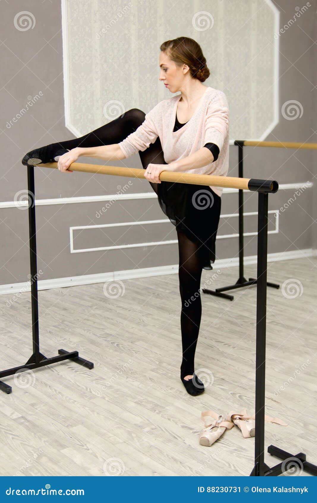 Pretty Young Graceful Ballet Dancer Warms Up Stock Image - Image of ...