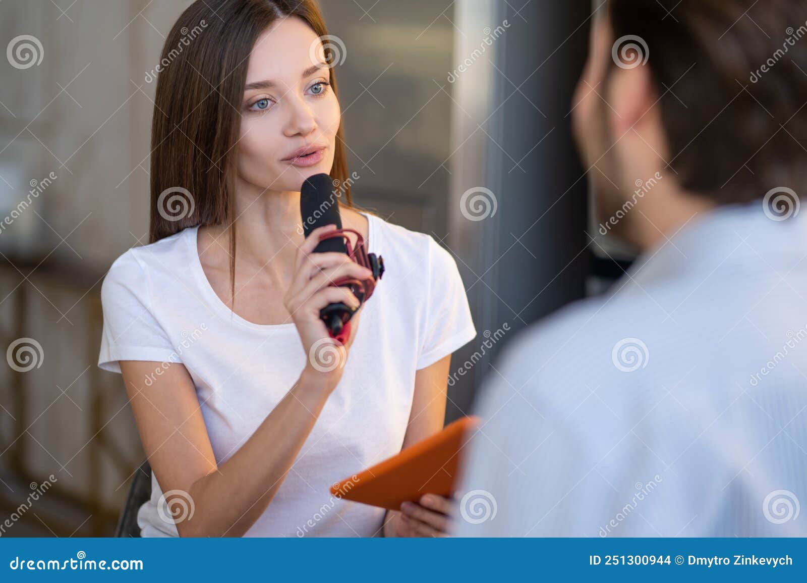Pretty Young Journalist Interviewing a Famous Person in a Studio Stock ...
