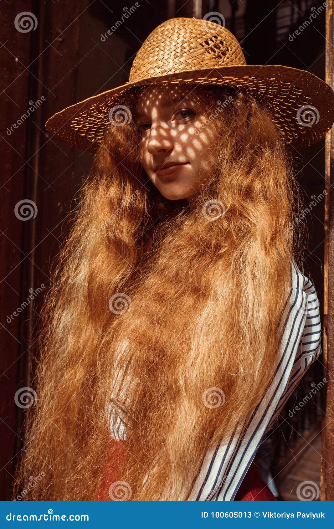Pretty Young Red Haired Model In Straw Hat With Shadow On Her Fa Stock