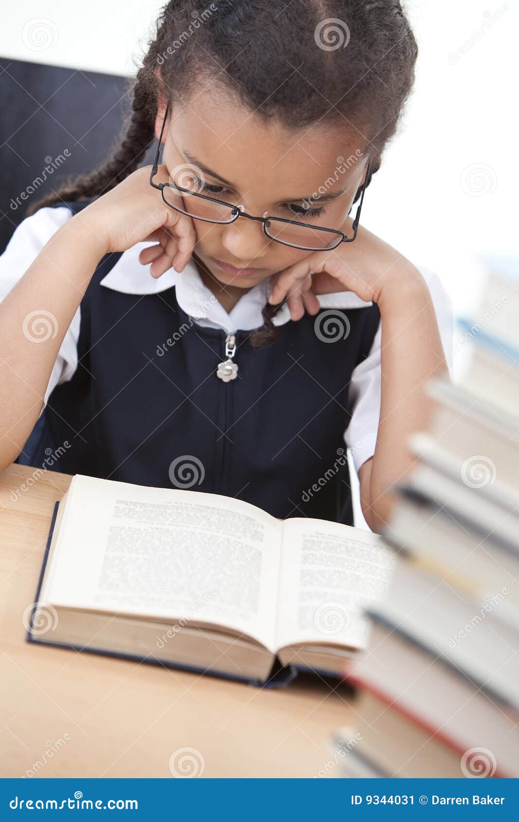 Pretty Young School Girl Reading a Book Stock Image - Image of desk ...