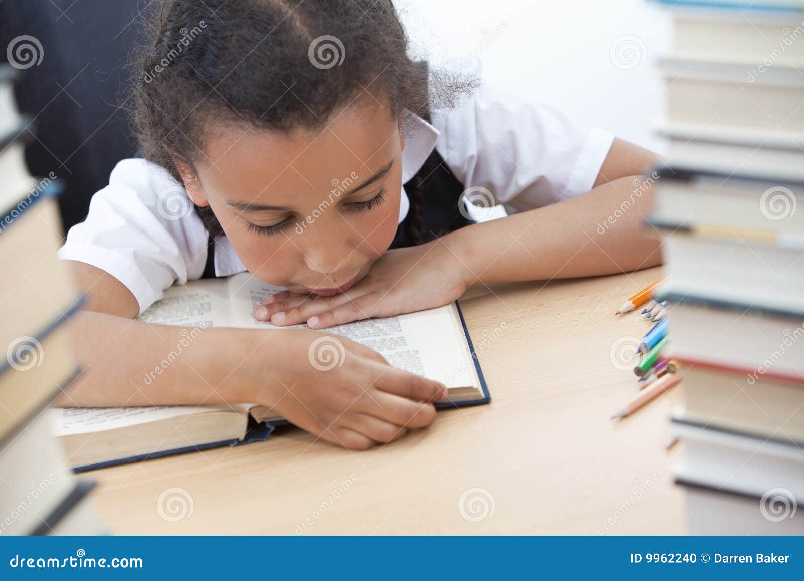 Pretty Young School Girl Reading a Book Stock Photo - Image of desk ...