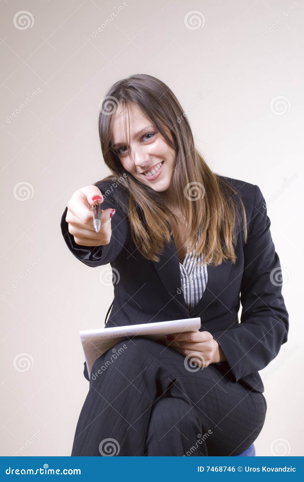 Pretty Young Secretary Pointing Her Pen at Camera Stock Photo - Image ...