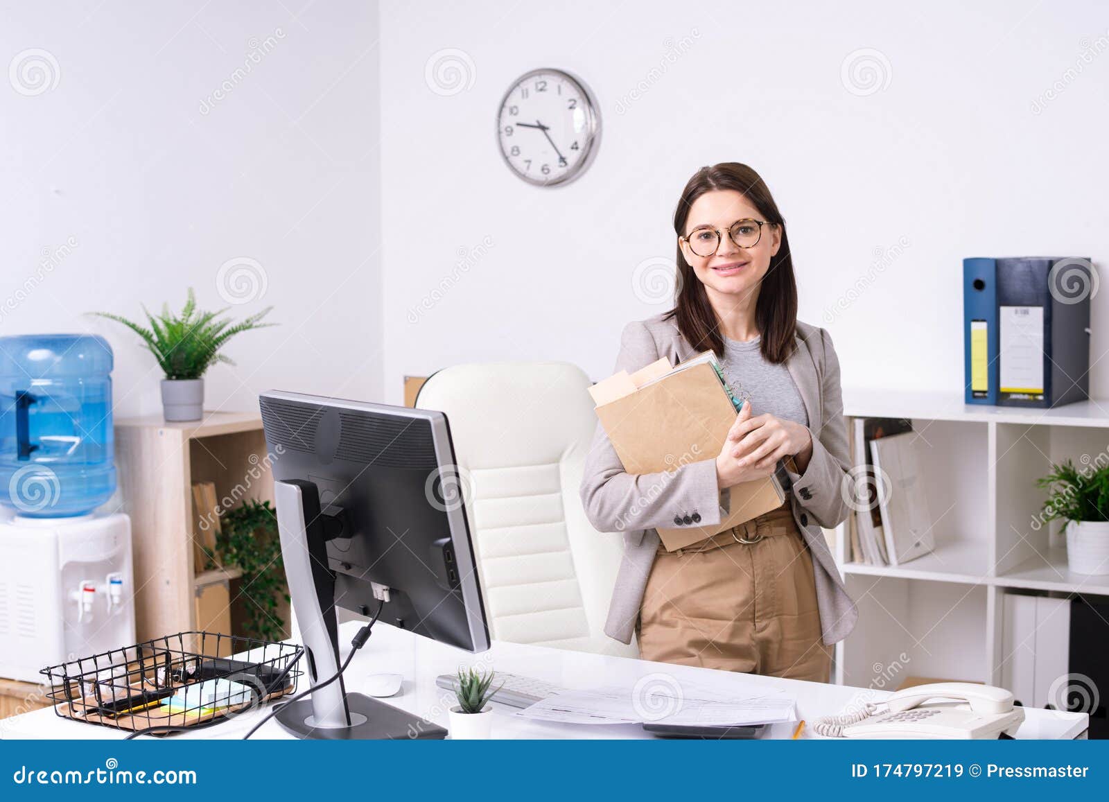 Pretty Young Smiling Office Manager or Accountant with Documents ...