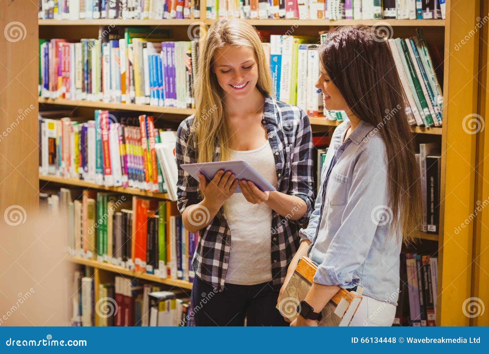 Pretty Young Students Working Together with Tablet Stock Photo - Image ...