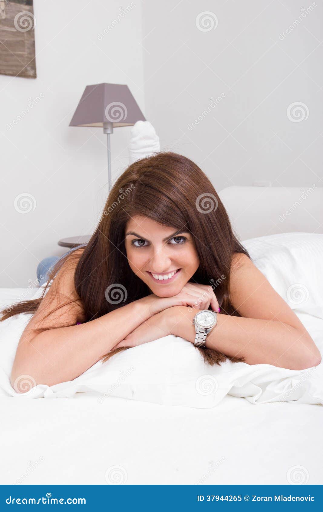 Pretty Young Woman on the Bed Smiling Stock Image - Image of bedroom ...