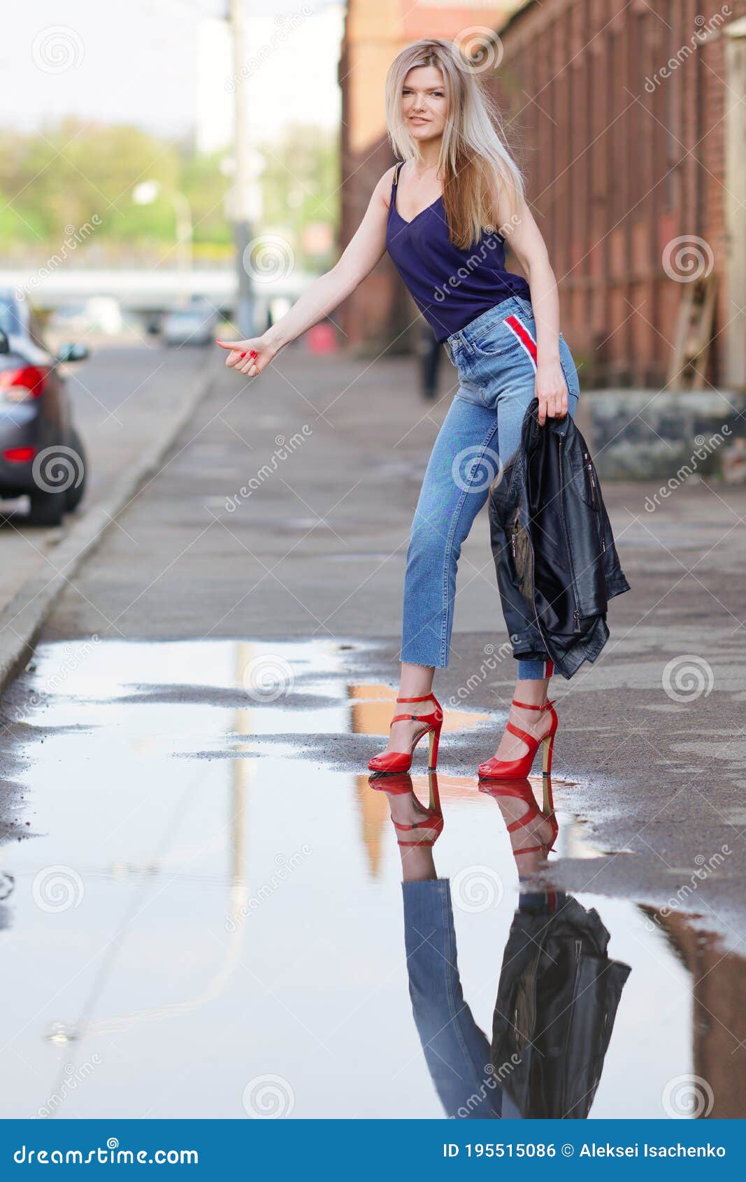 Pretty Young Woman Catching a Ride on a Road Stock Photo - Image of ...