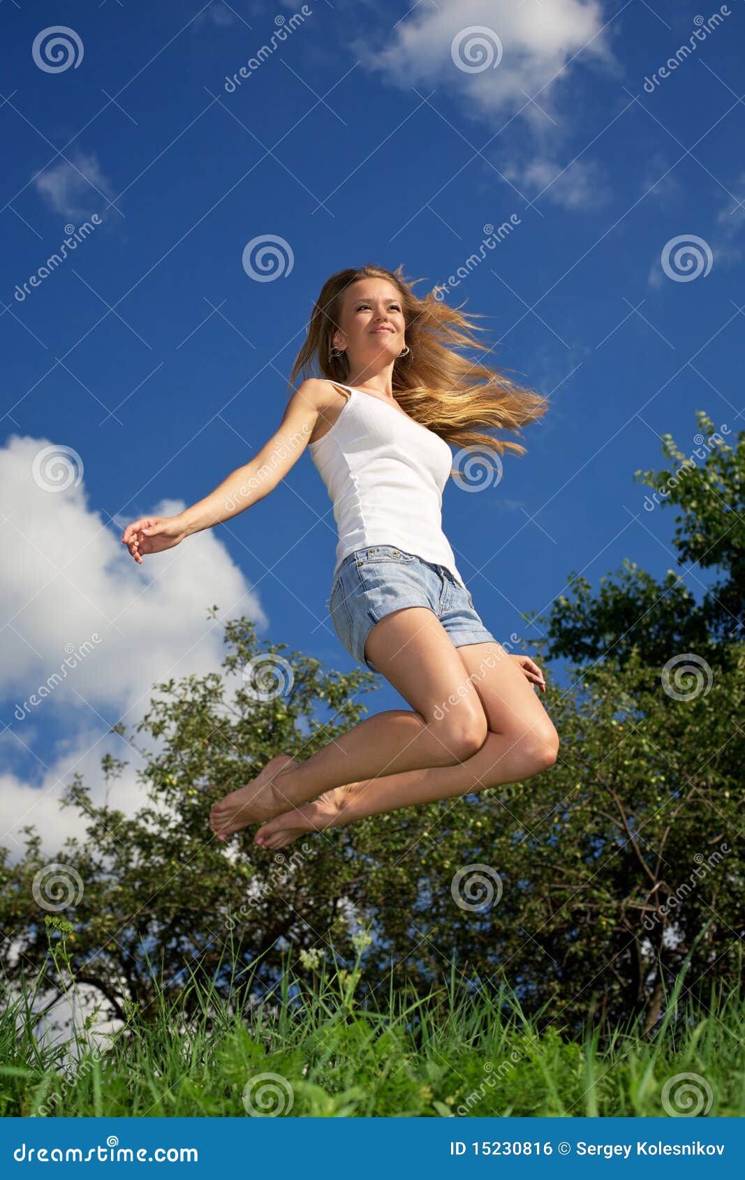 Pretty young woman jumping stock photo. Image of person - 15230816