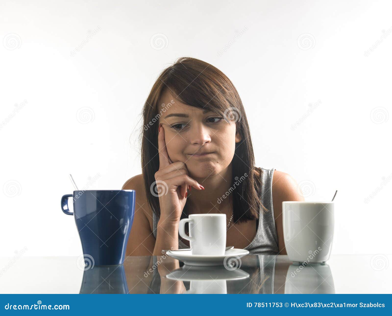 Pretty, Young Woman Looking Coffee Mugs on Bright Background Stock ...