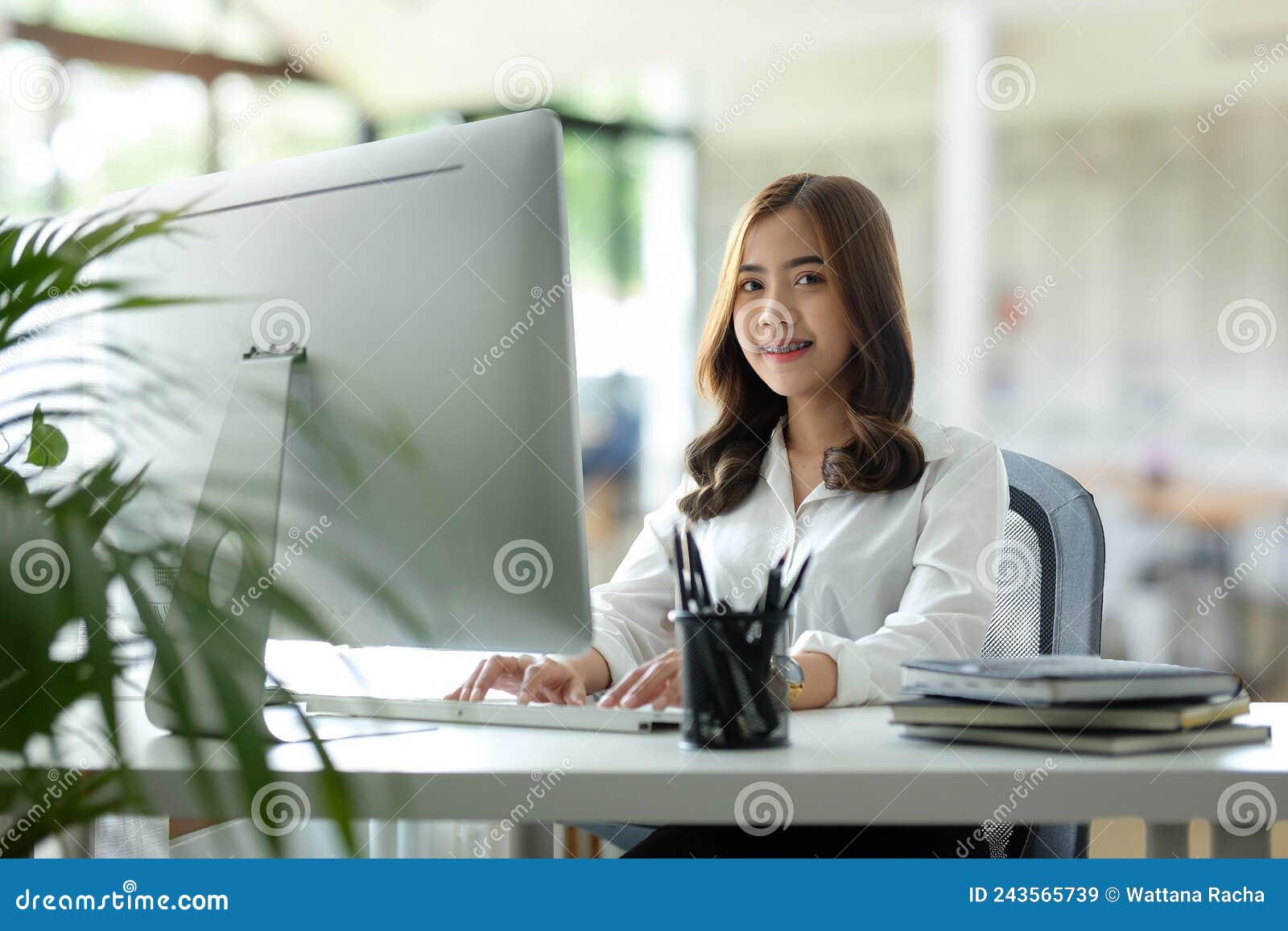 Pretty Young Woman Office Worker Working with Computer at Modern ...