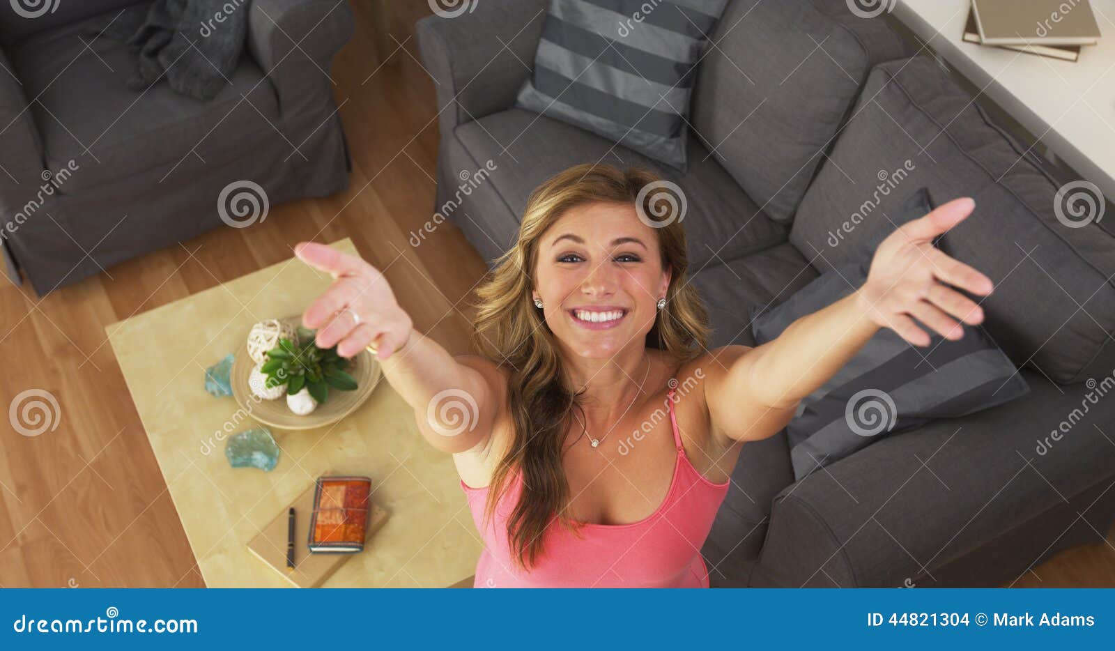 Pretty Young Woman Reaching Up Towards Camera Stock Photo - Image of ...