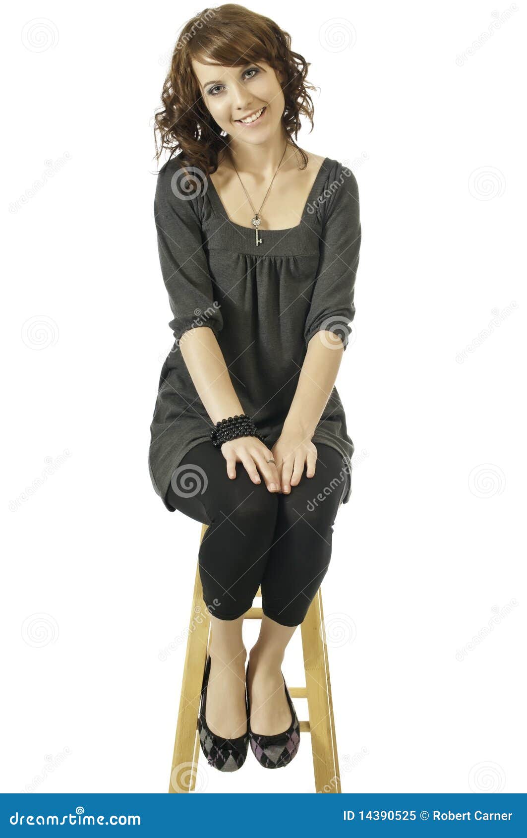 Pretty young woman seated stock image. Image of sitting - 14390525