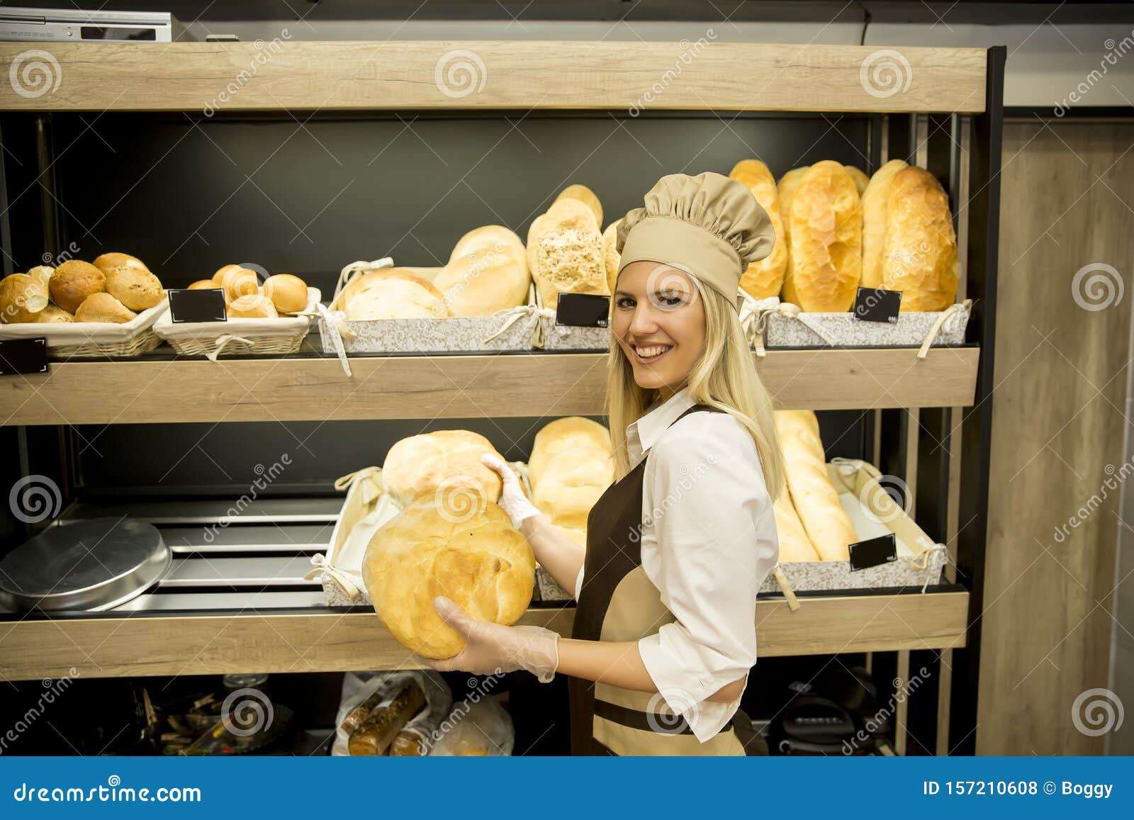 Pretty Young Woman Selling Fresh Bread in the Bakery Stock Photo ...