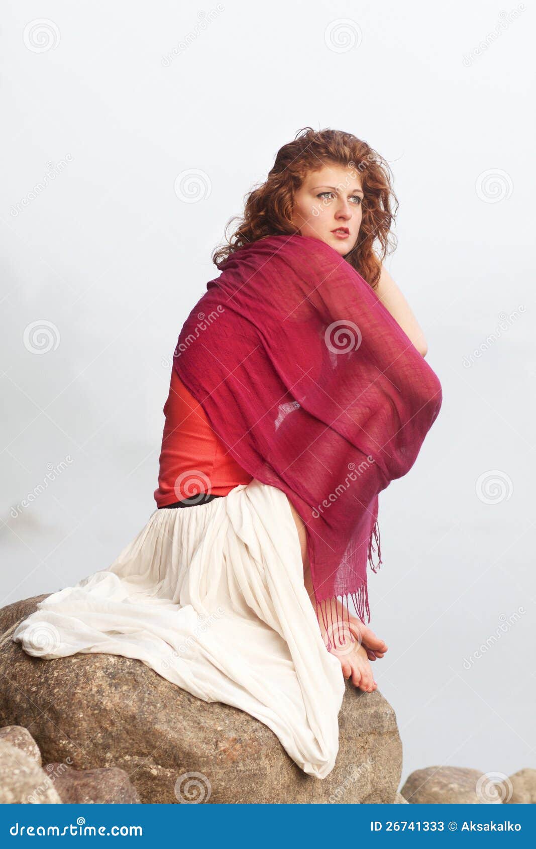 Pretty Young Woman Sits on a Stone Stock Image - Image of dress, person ...