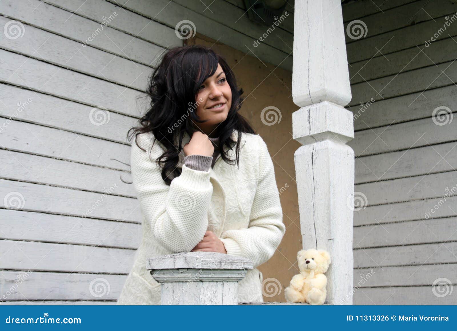 Pretty Young Woman Standing on a Veranda Stock Photo - Image of closeup ...