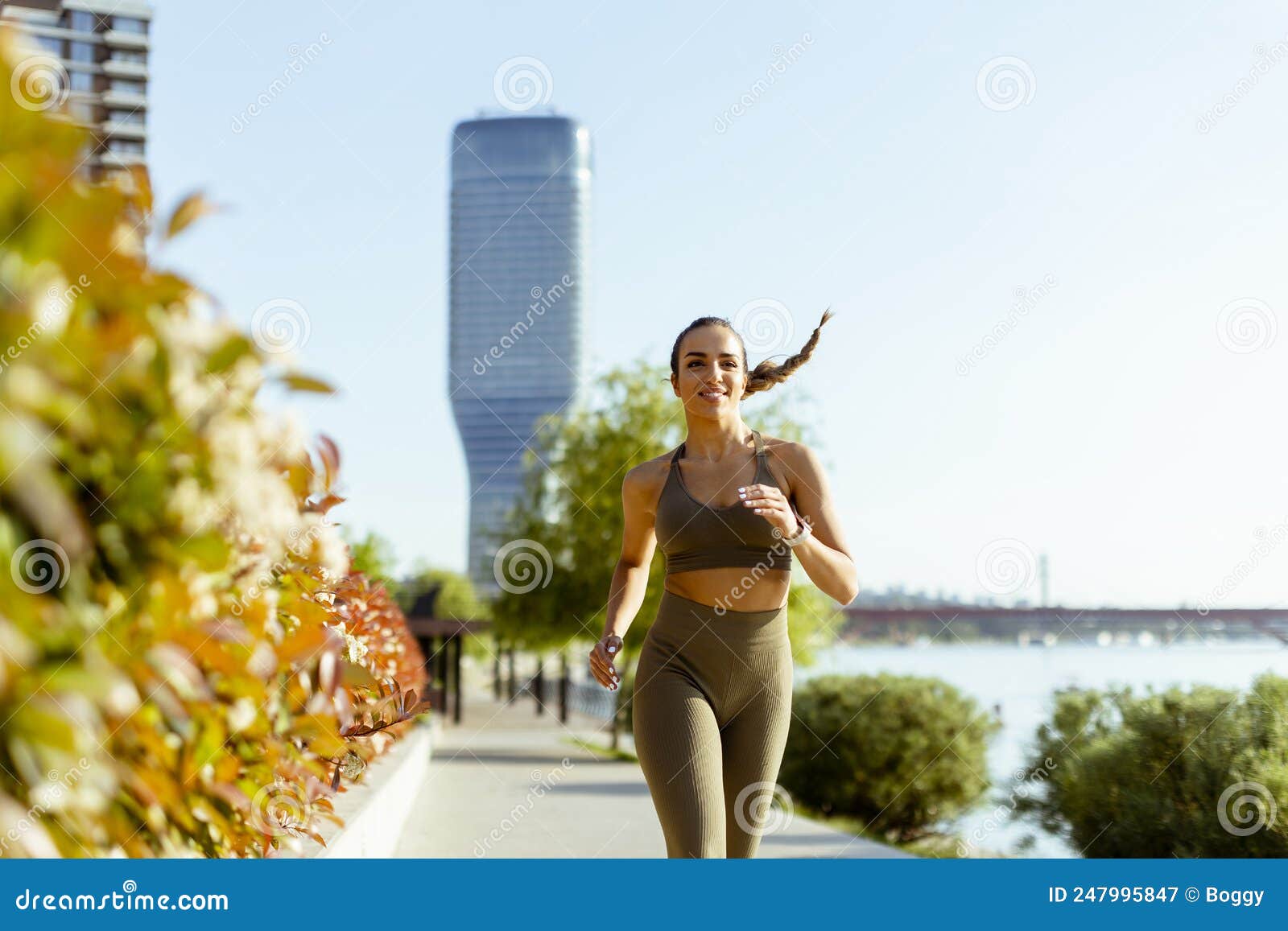 Young Woman Taking Running Exercise by the River Promenade Stock Image ...