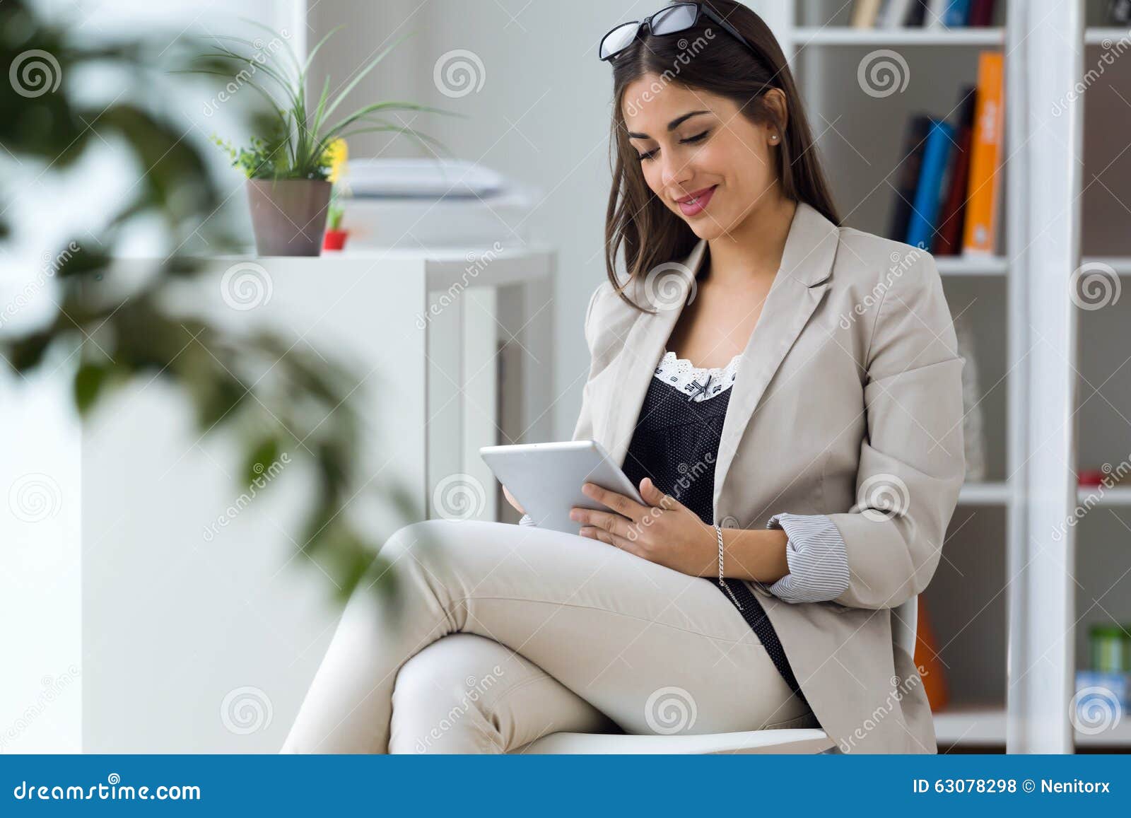 Pretty Young Woman Using Digital Tablet in the Office. Stock Photo ...