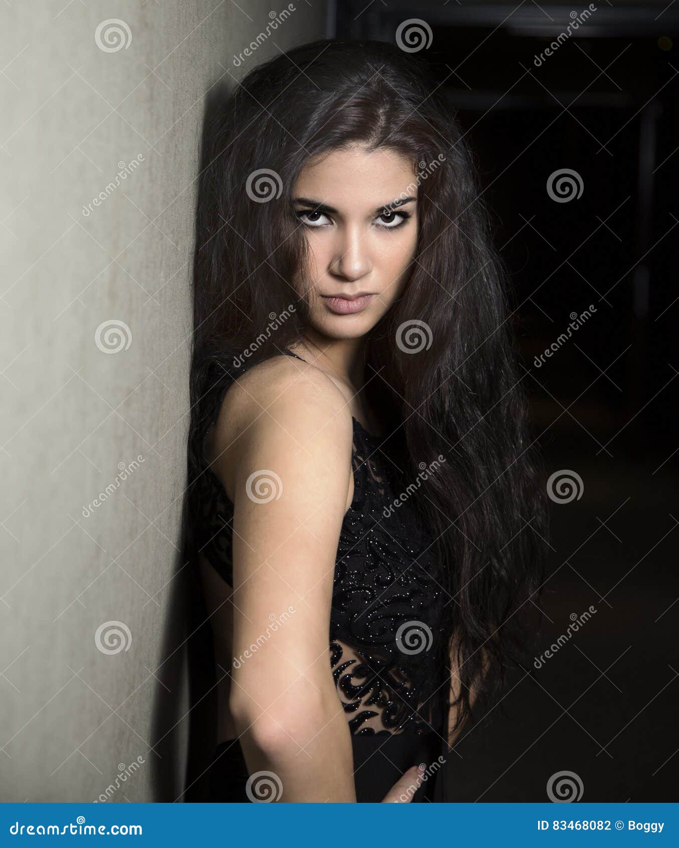 Pretty Young Woman by the Wall Stock Photo - Image of beautiful ...