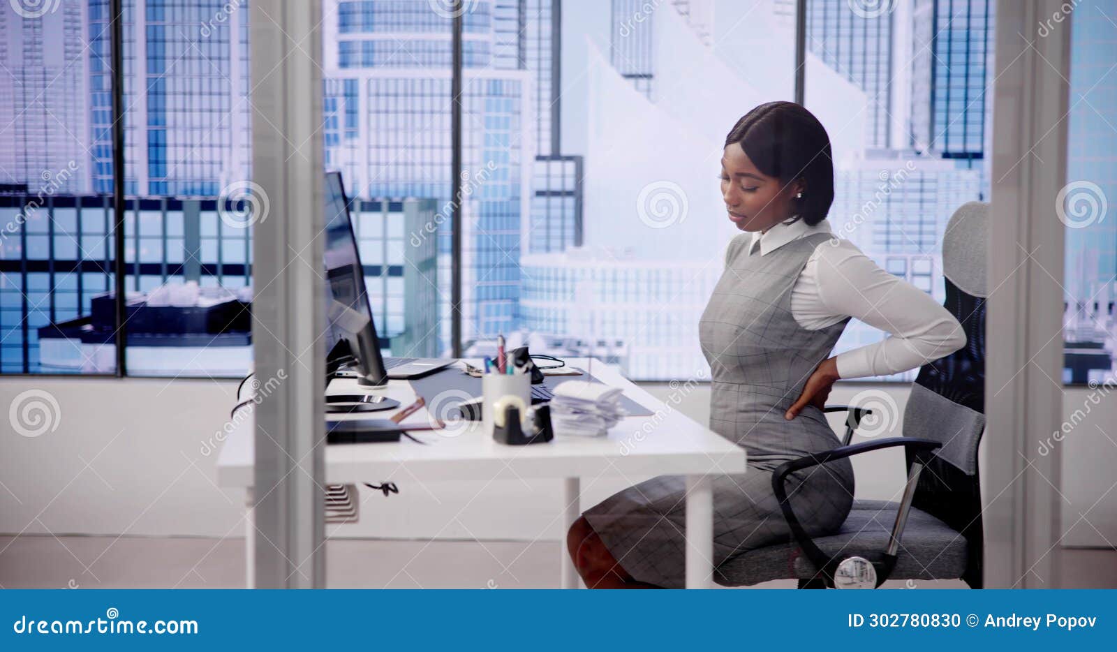 Preventing Bad Back Posture: Woman Overcoming Office Computer Stock ...