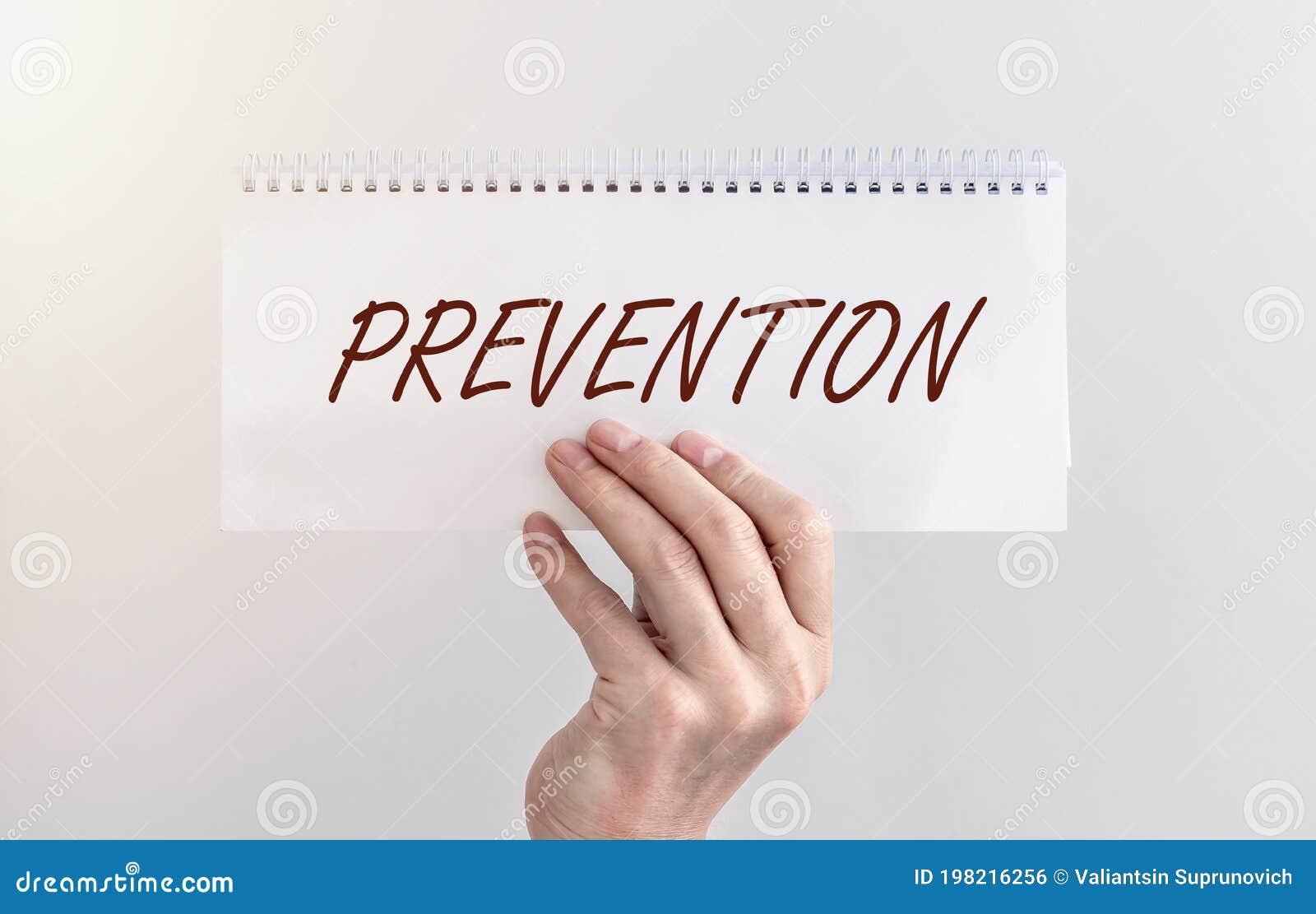 Prevention Word on White Paper in Male Hand Over White Wall Stock Photo ...
