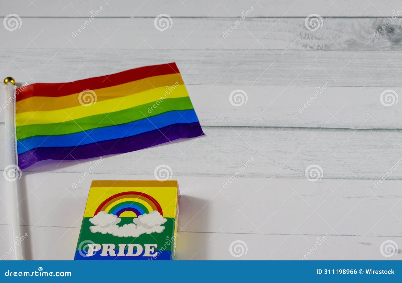 Pride Box and a Rainbow Flag on White Table Stock Photo - Image of ...