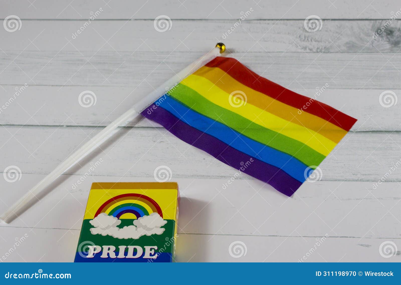 Pride Box and a Rainbow Flag on White Table Stock Photo - Image of ...