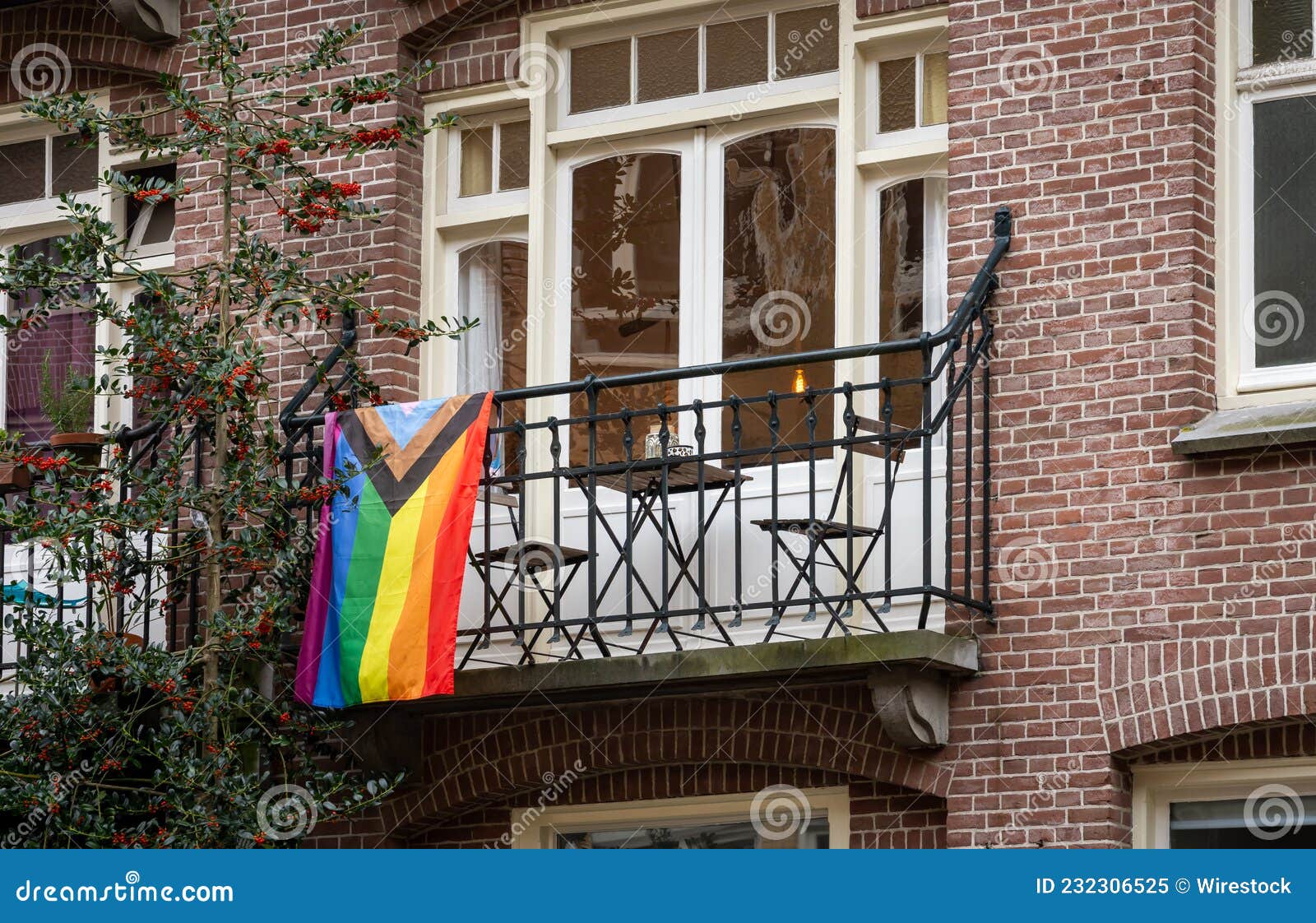 Pride Flag on a Balcony of a Building in Amsterdam, the Netherlands ...