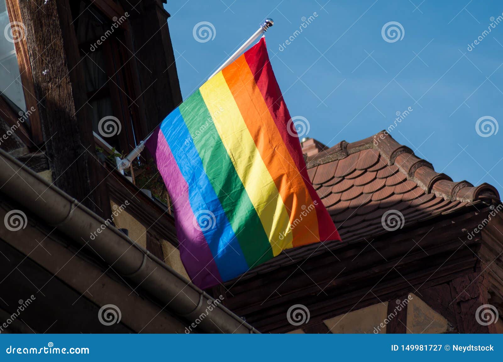Pride Flag on Window of Building Stock Image - Image of flag, diversity ...