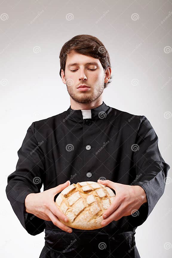 Priest with bread stock image. Image of clerical, catholicism - 38596077