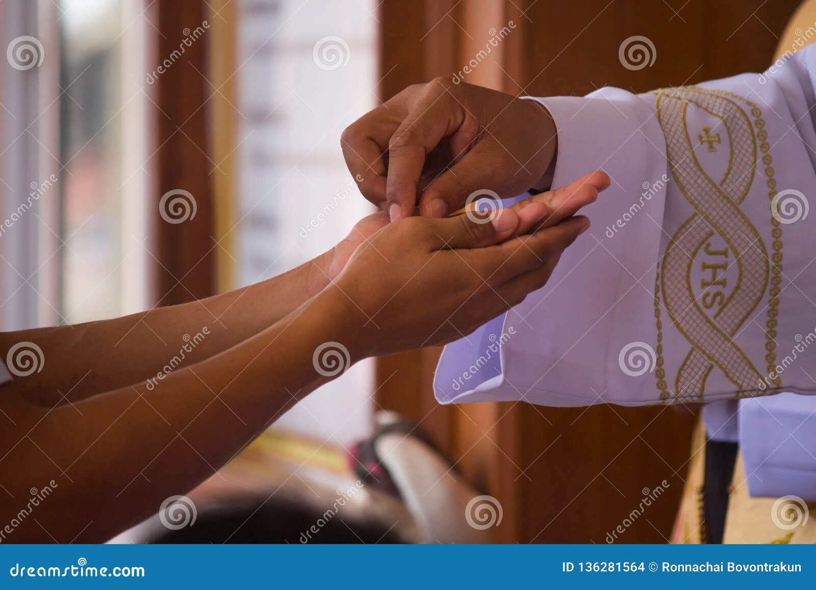 Closeup of Priest with Communion in the Hand Stock Photo - Image of ...