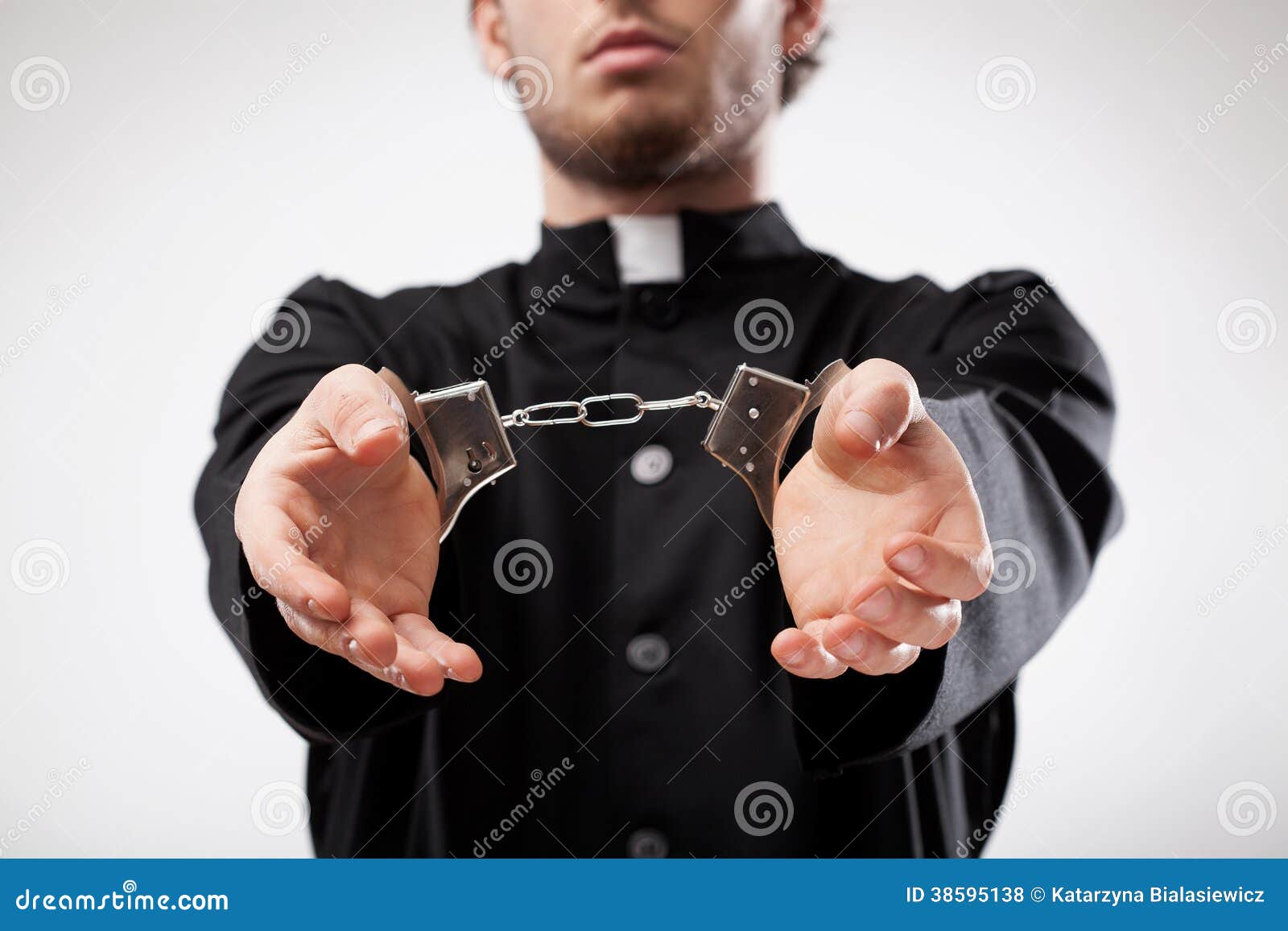 Handcuffed Catholic Priest Stock Photo | CartoonDealer.com #129912504