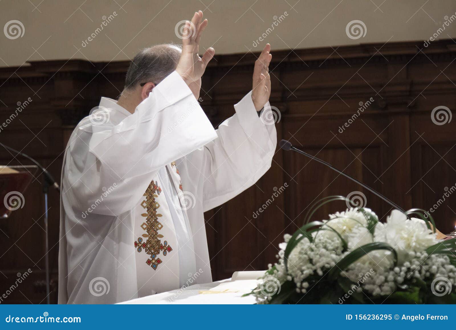 Priest With Hands Raised In The Function Of Preaching On The Altar ...