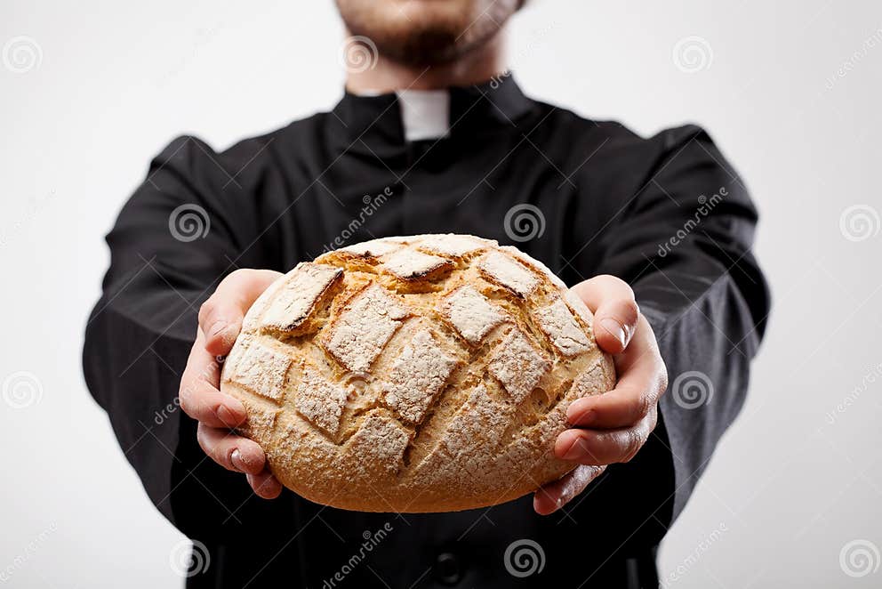 Priest Holding Loaf of Bread Stock Image - Image of sacred, religious ...